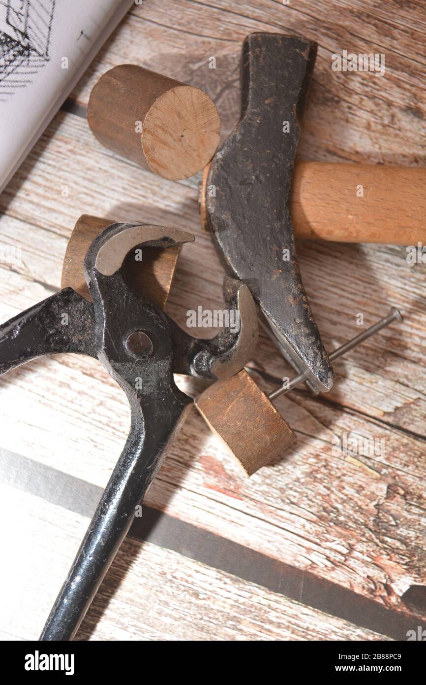 carpenter work tools hammer nail pincer wood Stock Photo - Alamy