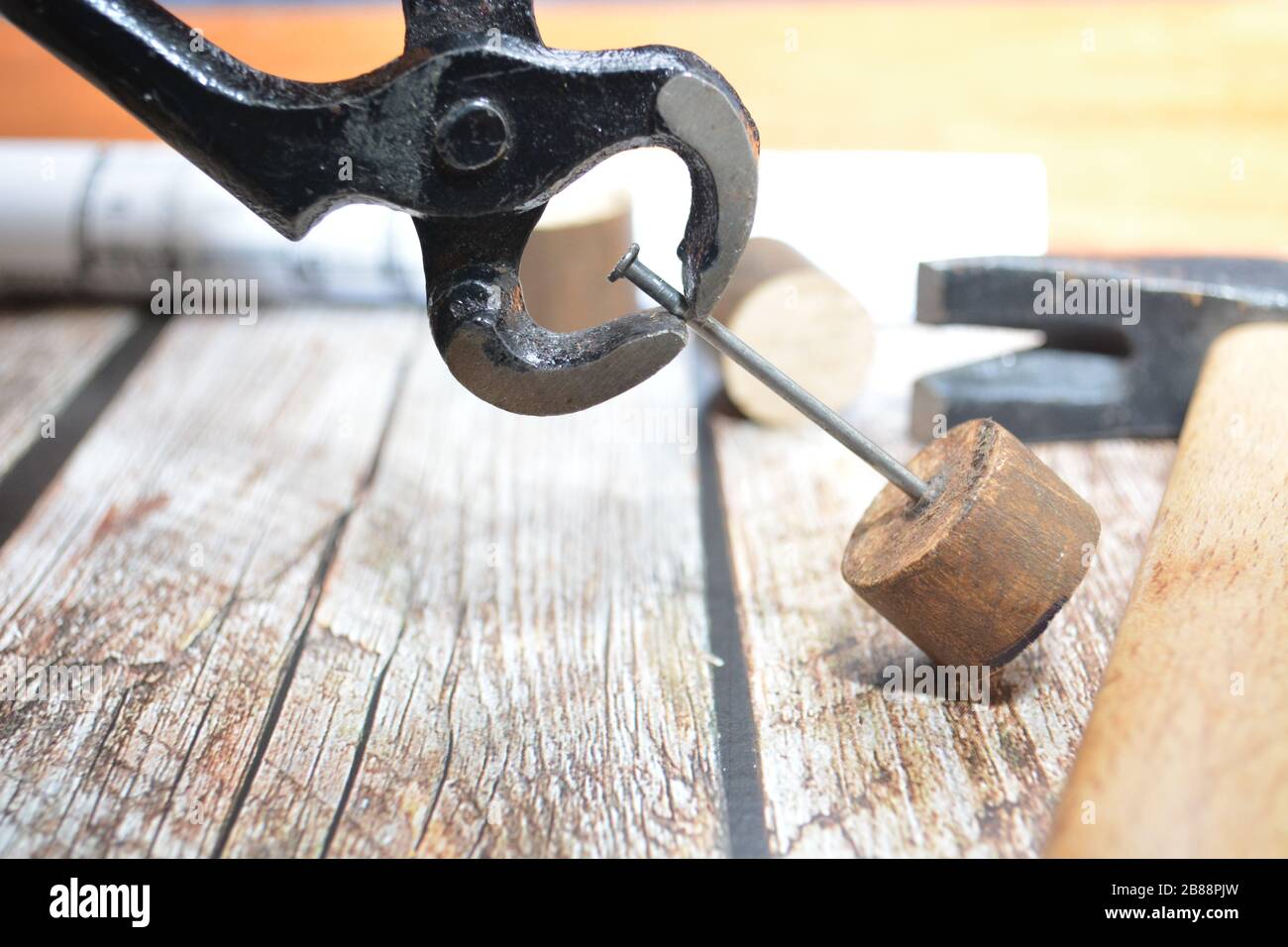 carpenter work tools hammer nail pincer wood Stock Photo - Alamy
