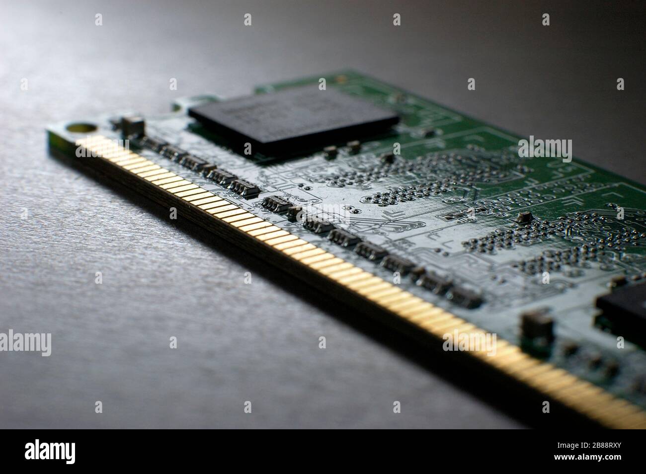 Close up memory board with SMD chip lies on the table. Computer parts ...