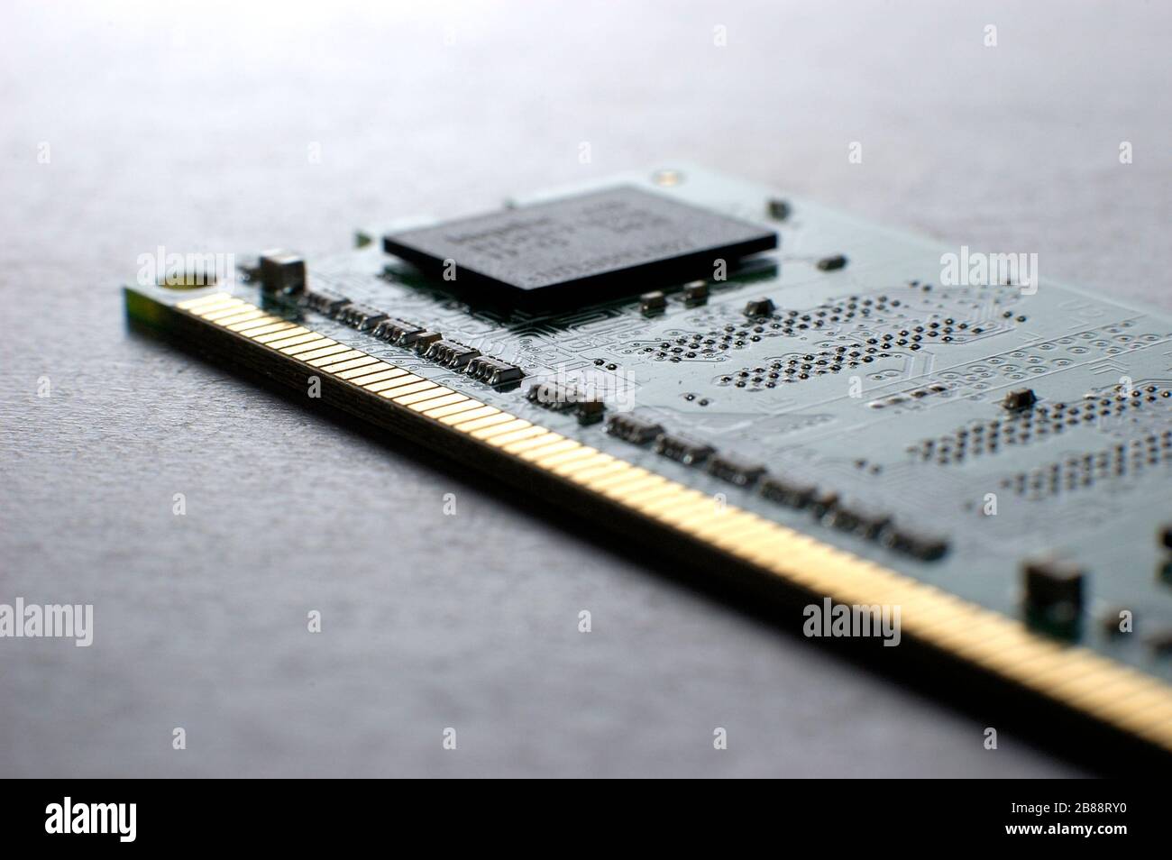 Close up memory board with SMD chip lies on the table. Computer parts ...