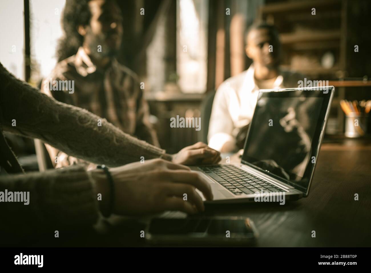 Multi ethnic business people typing hi-res stock photography and images ...