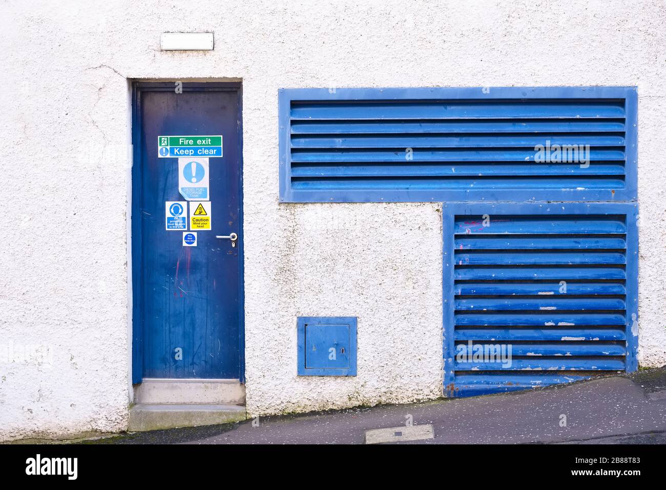 Plant room fire exit keep clear blue door and wall Louvre Stock Photo ...