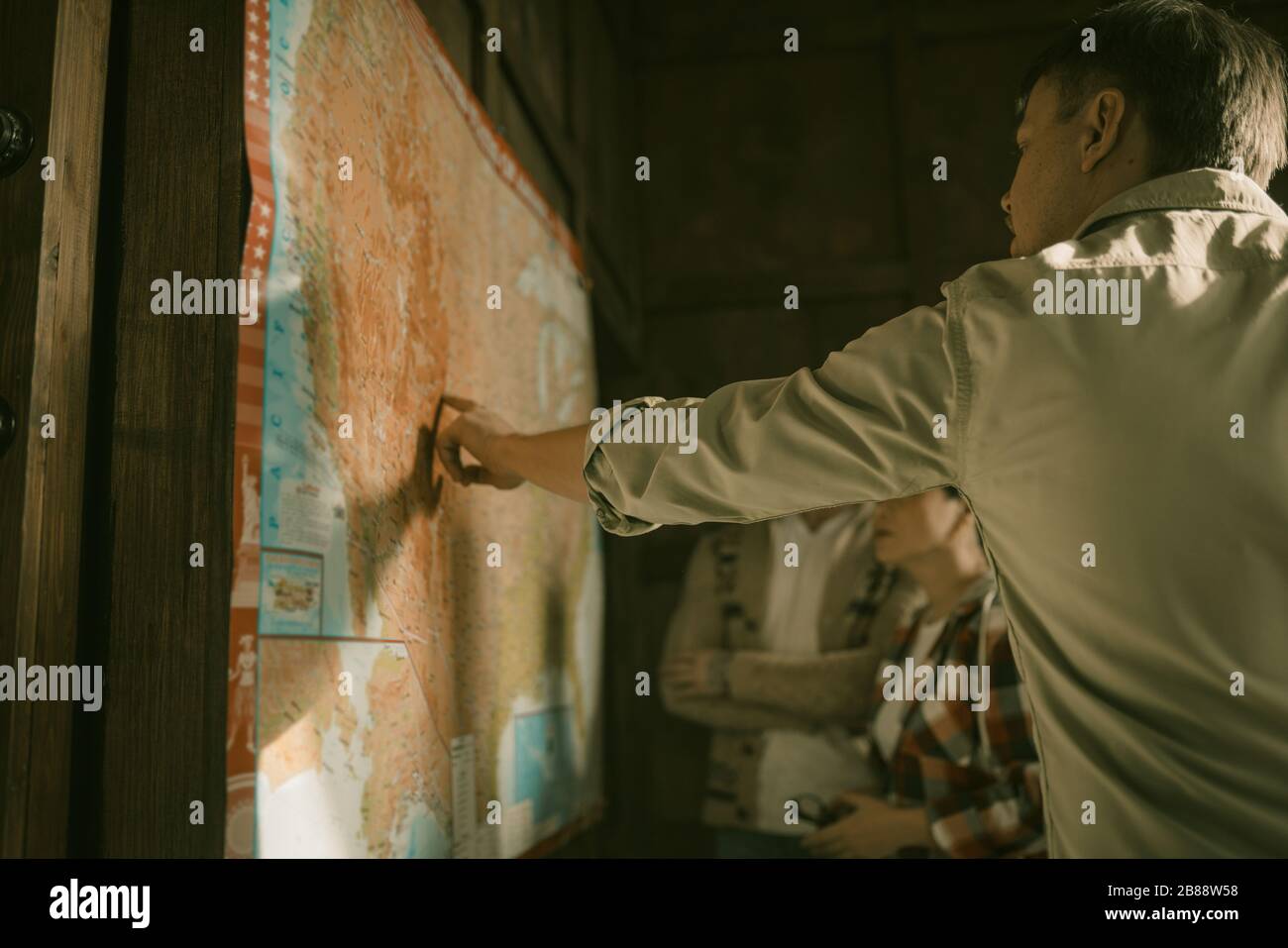 Group of freelancers working with paper map Stock Photo - Alamy