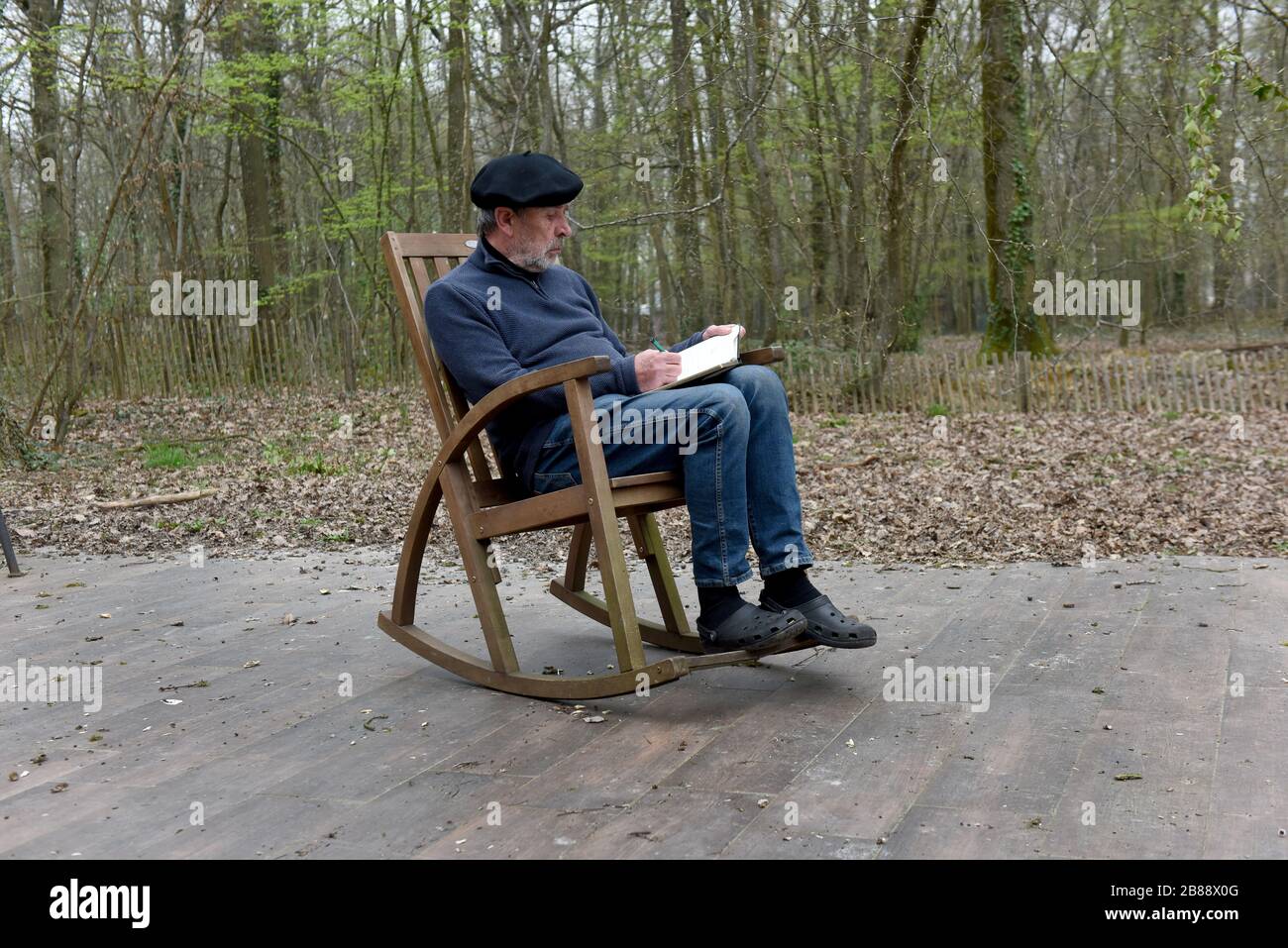 Man sitting in rocking chair hi-res stock photography and images - Alamy
