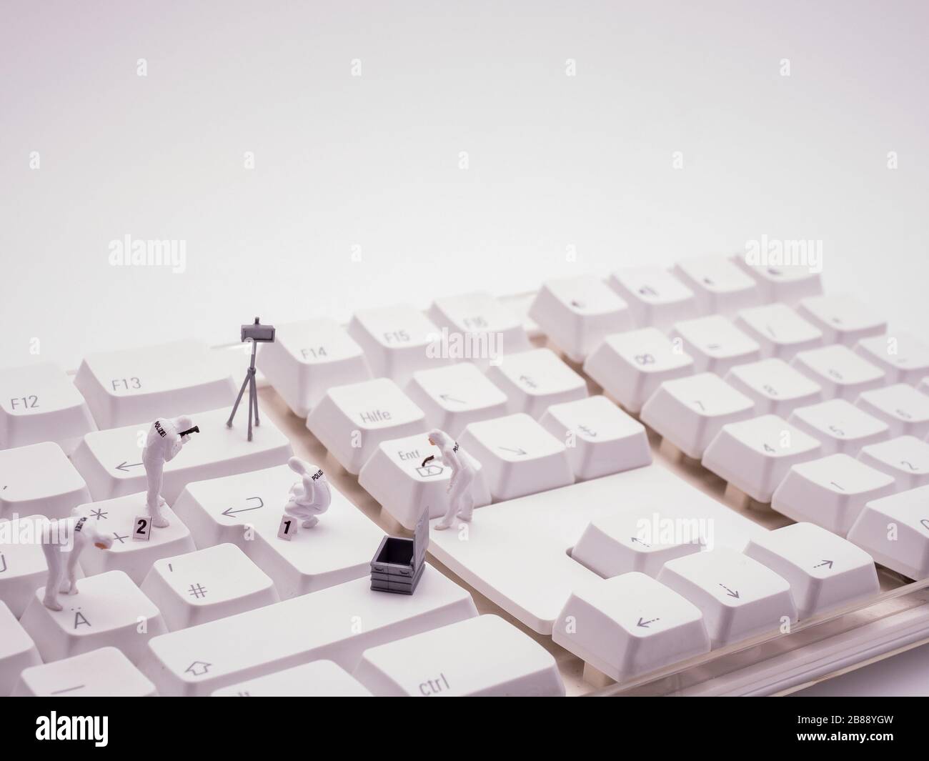 Miniatur forensics examining computer keyboard Stock Photo - Alamy