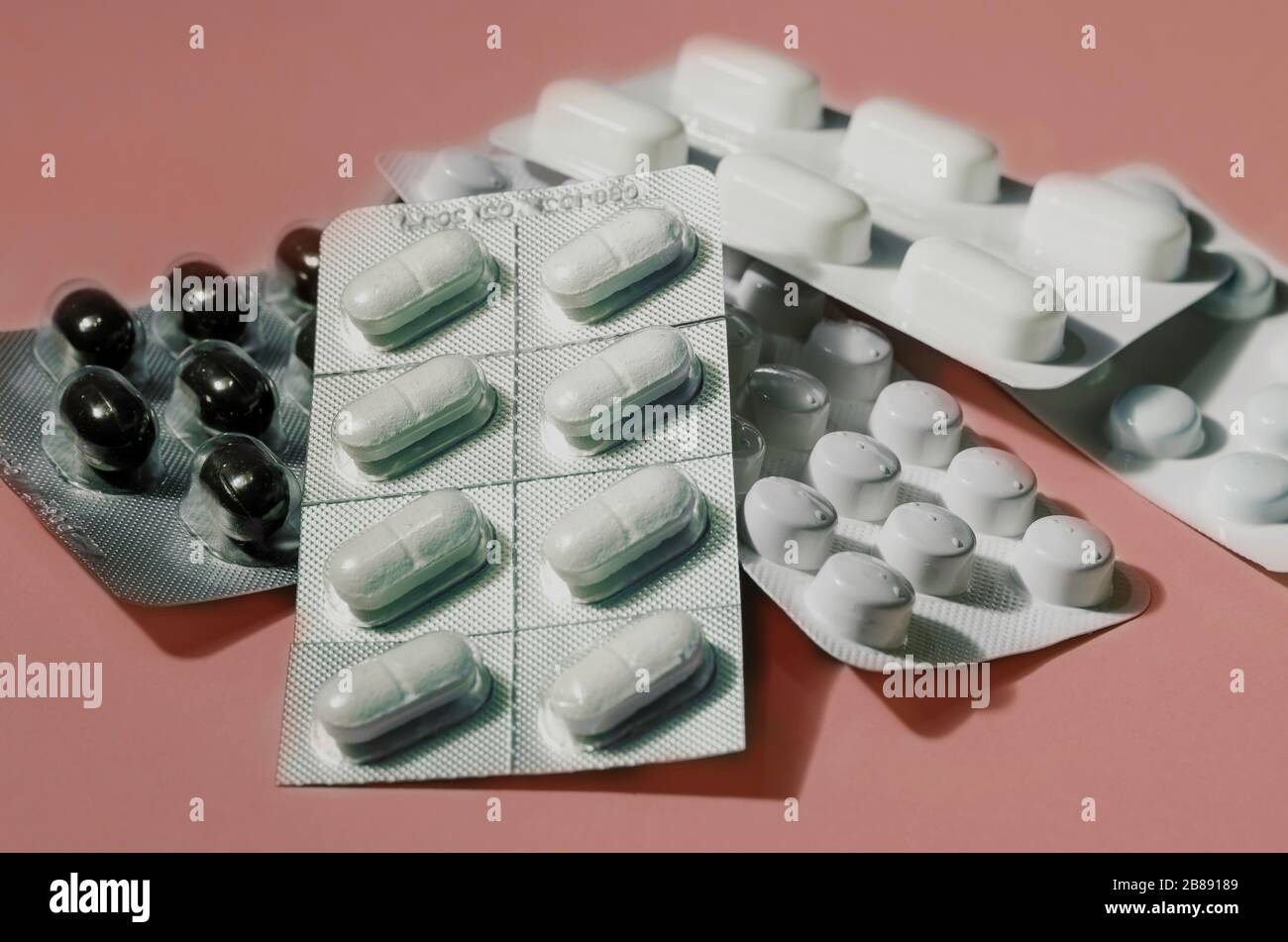 pill and drugs on a red background Stock Photo - Alamy