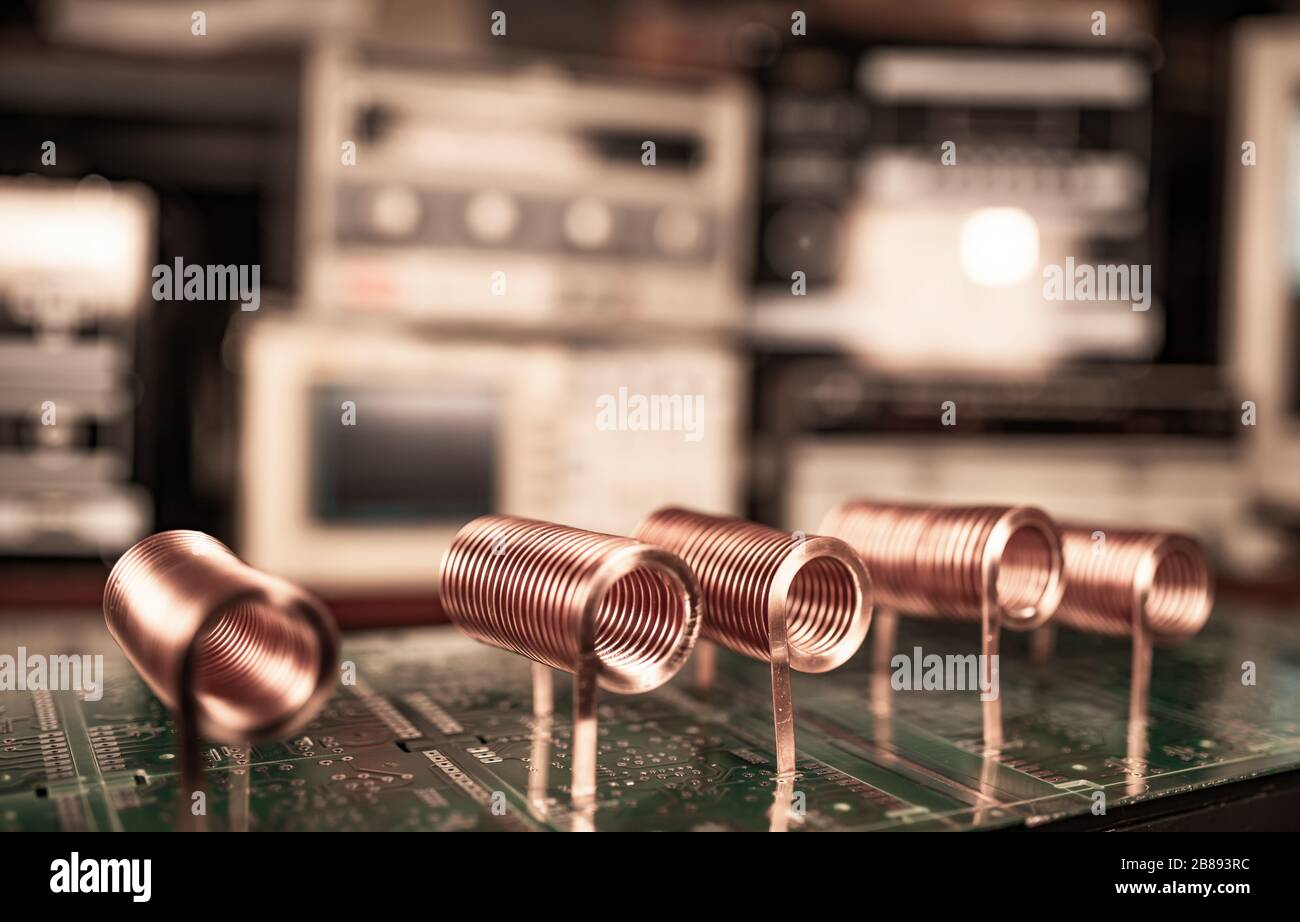 Close-up of high-frequency copper wire on green microcircuit on ...
