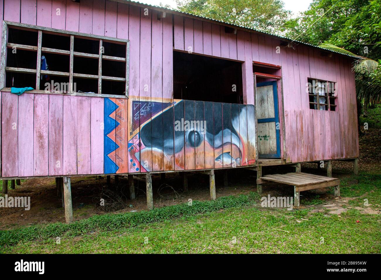 Exotic paintings on houses of the Ticuna tribe community, Mocagua ...
