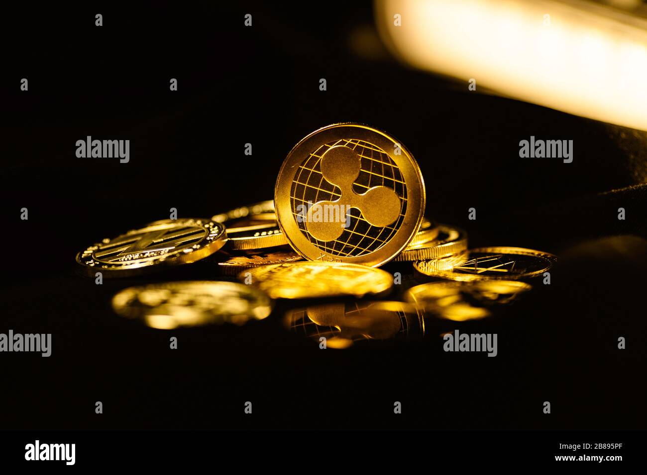 Ripple coin on black background. Currency appreciation Stock Photo - Alamy