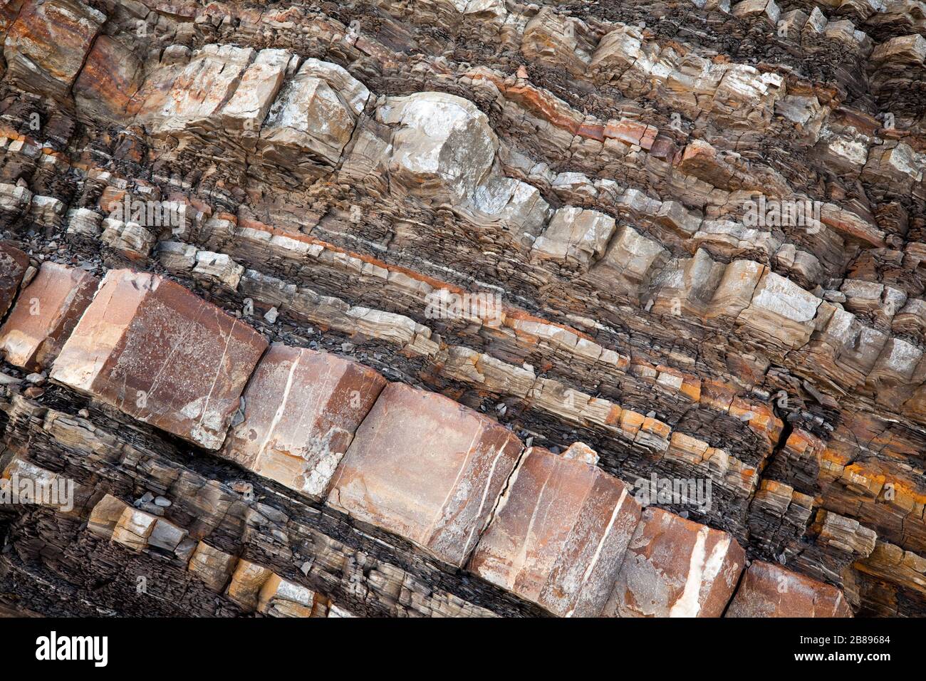 Close-up of rocky rock on a slice of a mountain. The concept of multi ...