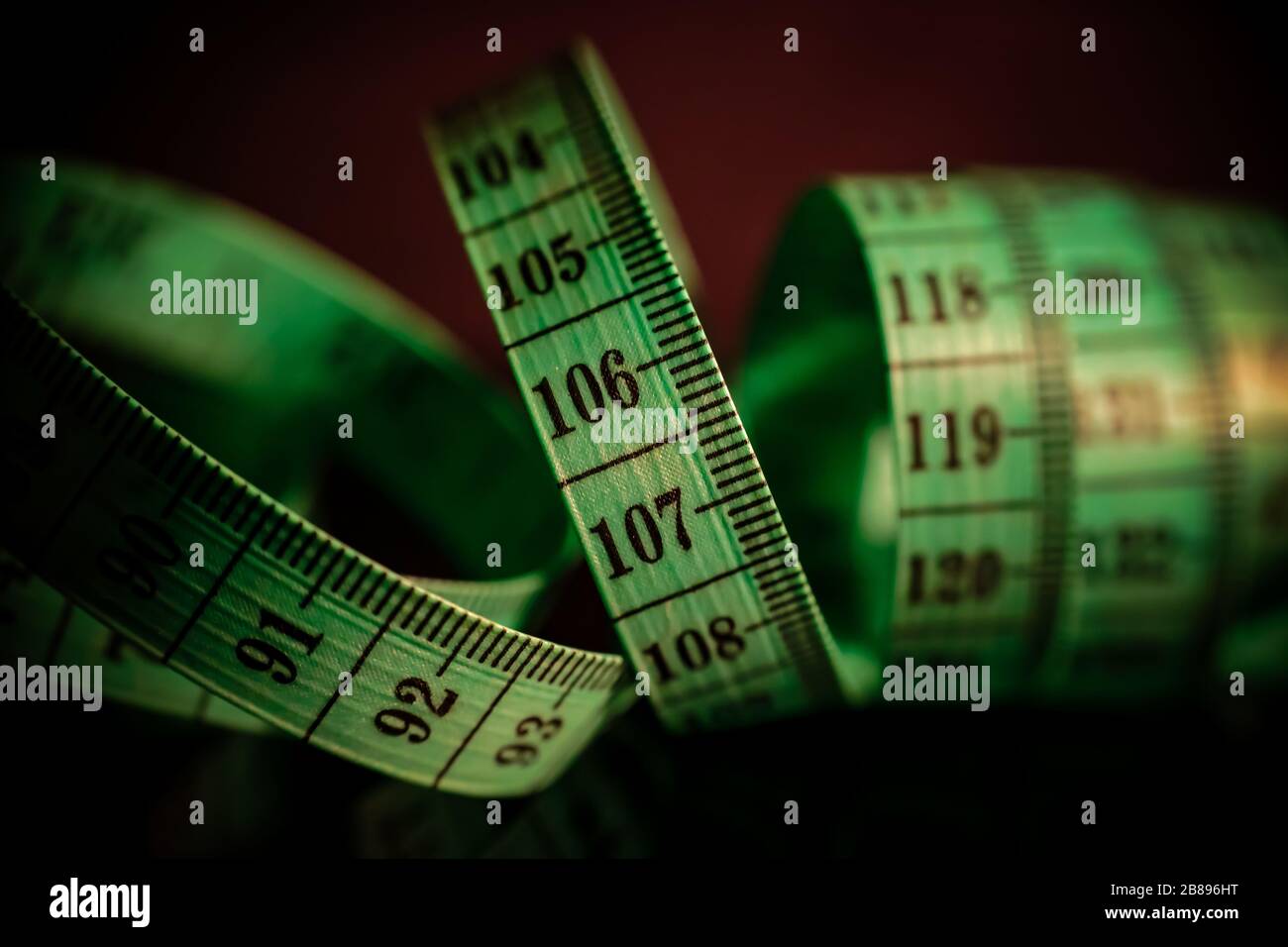 A swirled green tailoring meter use as a tool or instrument for ...