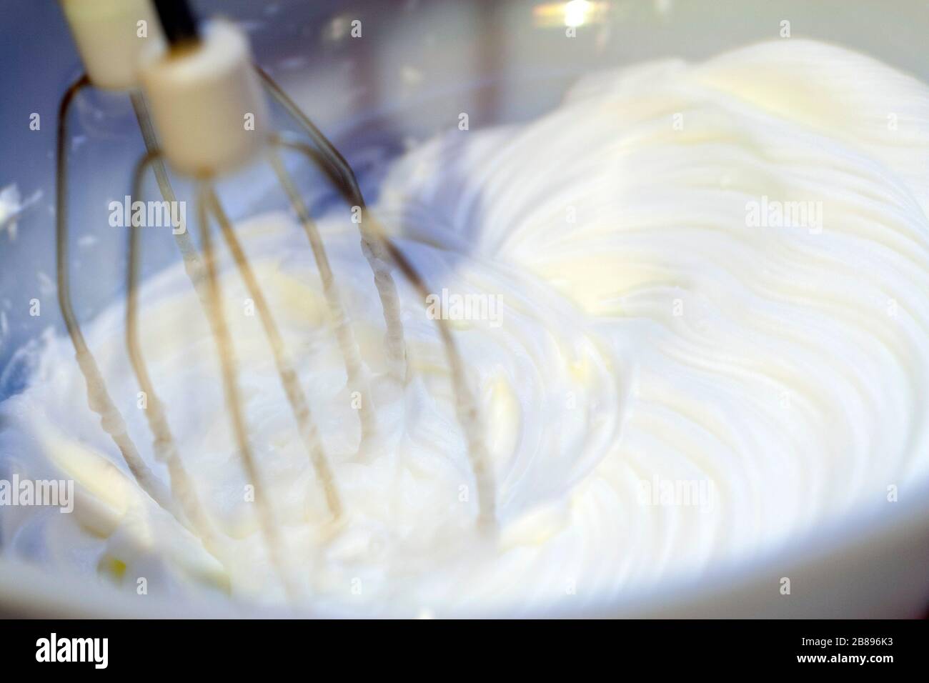 Mixing cream mixer in container hi-res stock photography and images - Alamy
