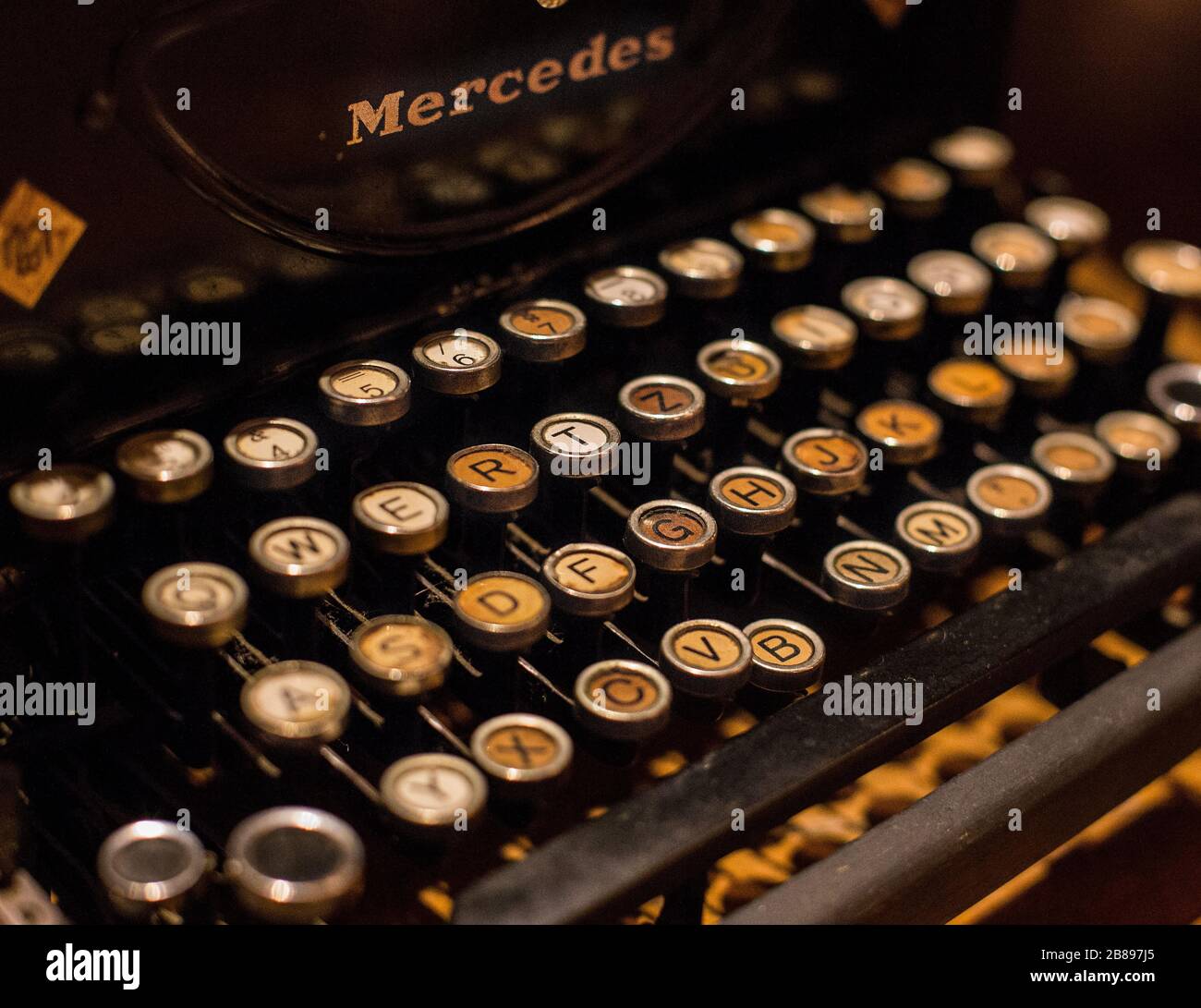 An old black metal typwriter with close up on letters from keyboards ...