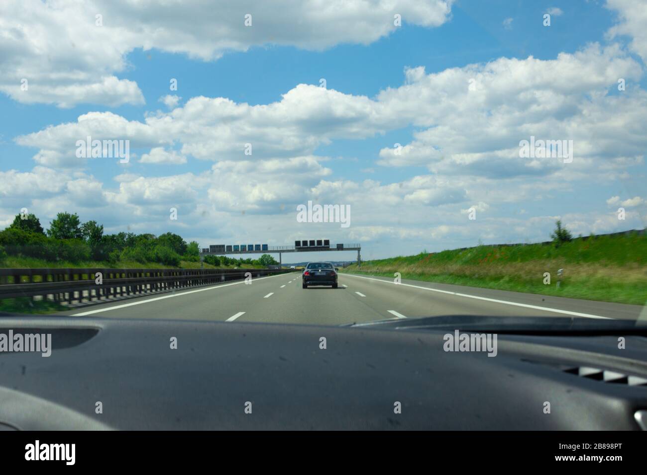 Driving on a highway, picture made from the car, view to the traffic ...