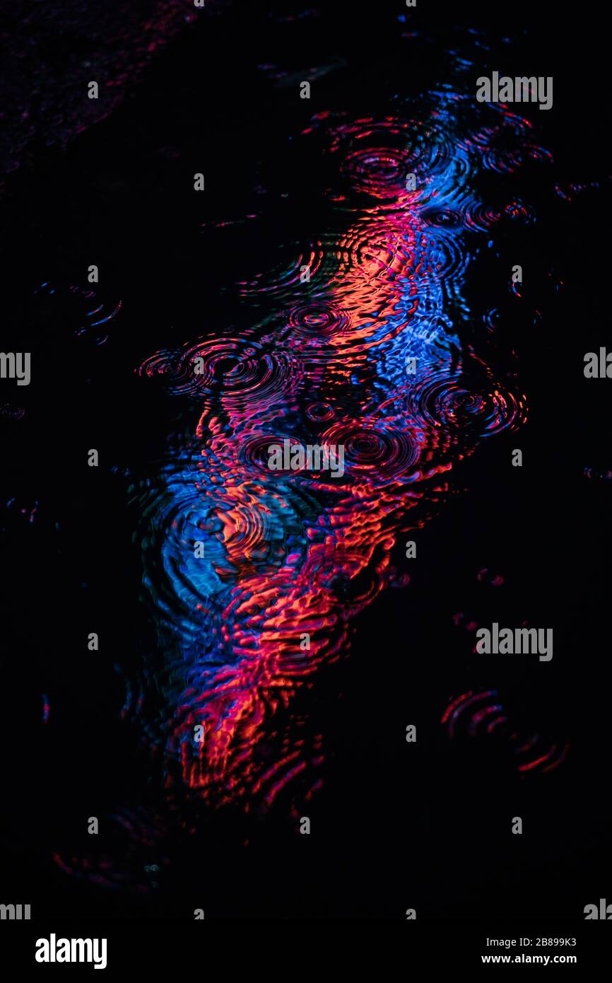 Reflection road rain neon sign hi-res stock photography and images - Alamy