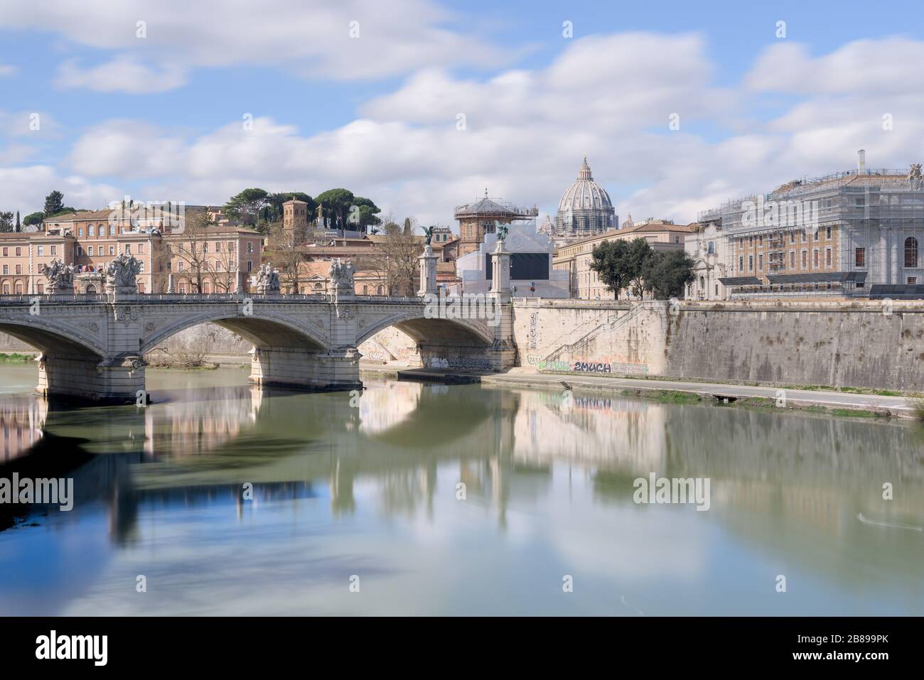Saint Peter Basilica in the Vatican, from across the Tiber river bridge ...