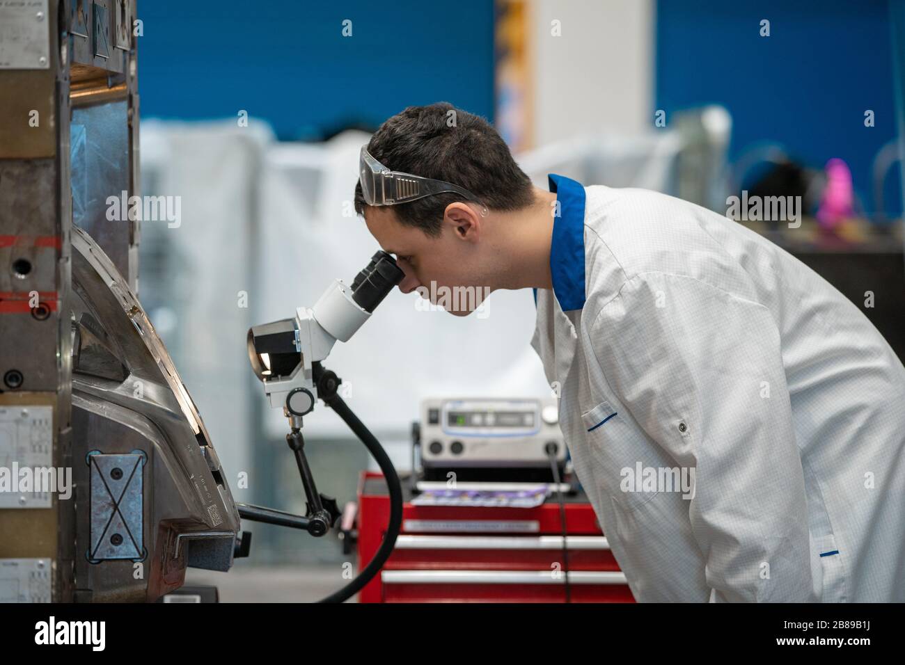 the engineer checks the correct setting of the metal mold for castings ...
