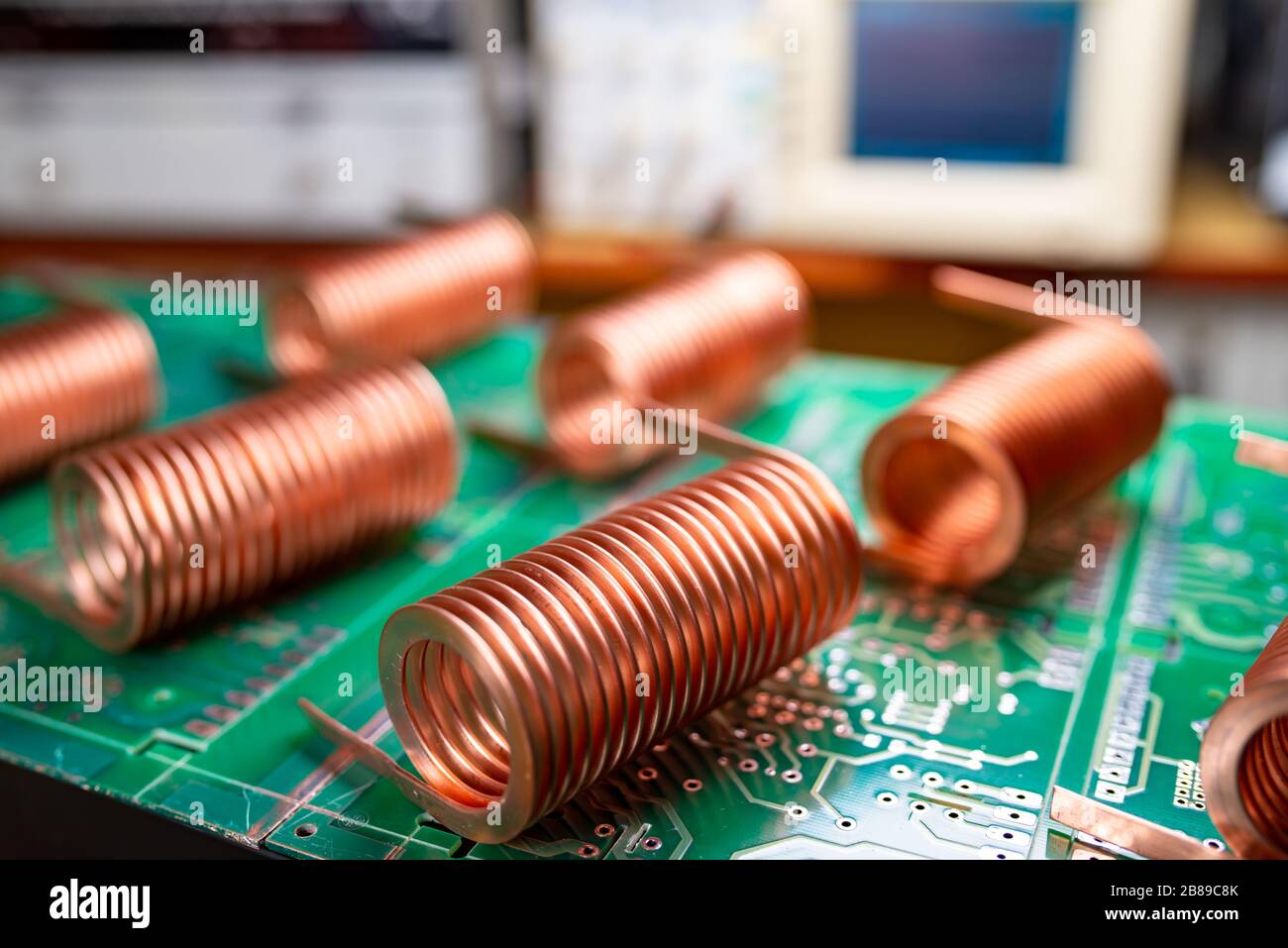 Close-up of high-frequency copper wire on green microcircuit on ...