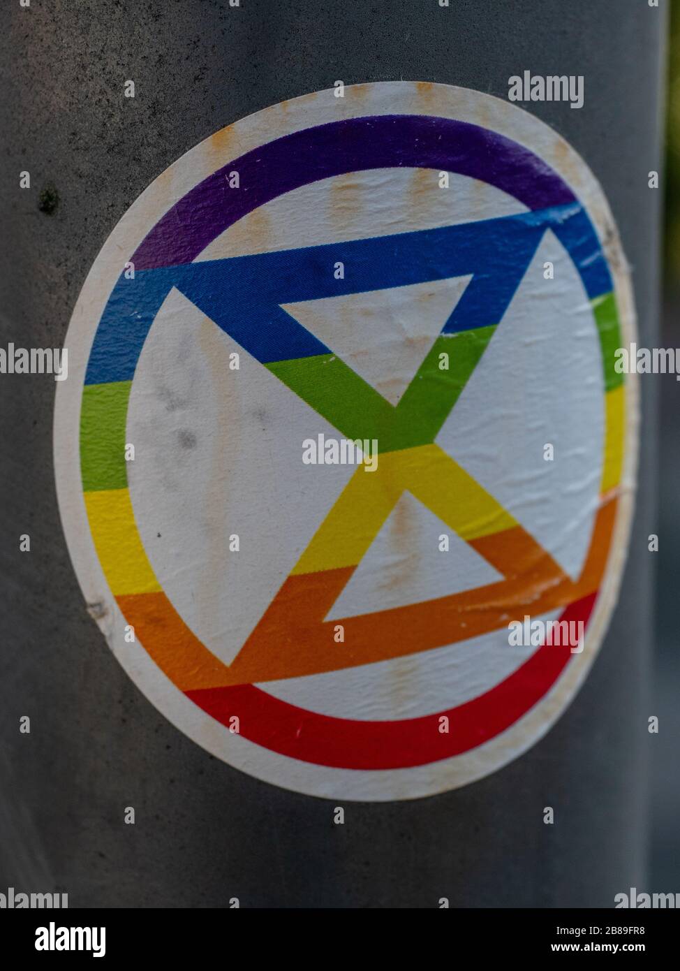 Rainbow coloured Extinction Rebellion Sticker Stock Photo - Alamy