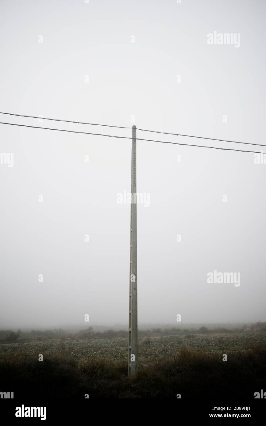 Power line in fog hi-res stock photography and images - Alamy