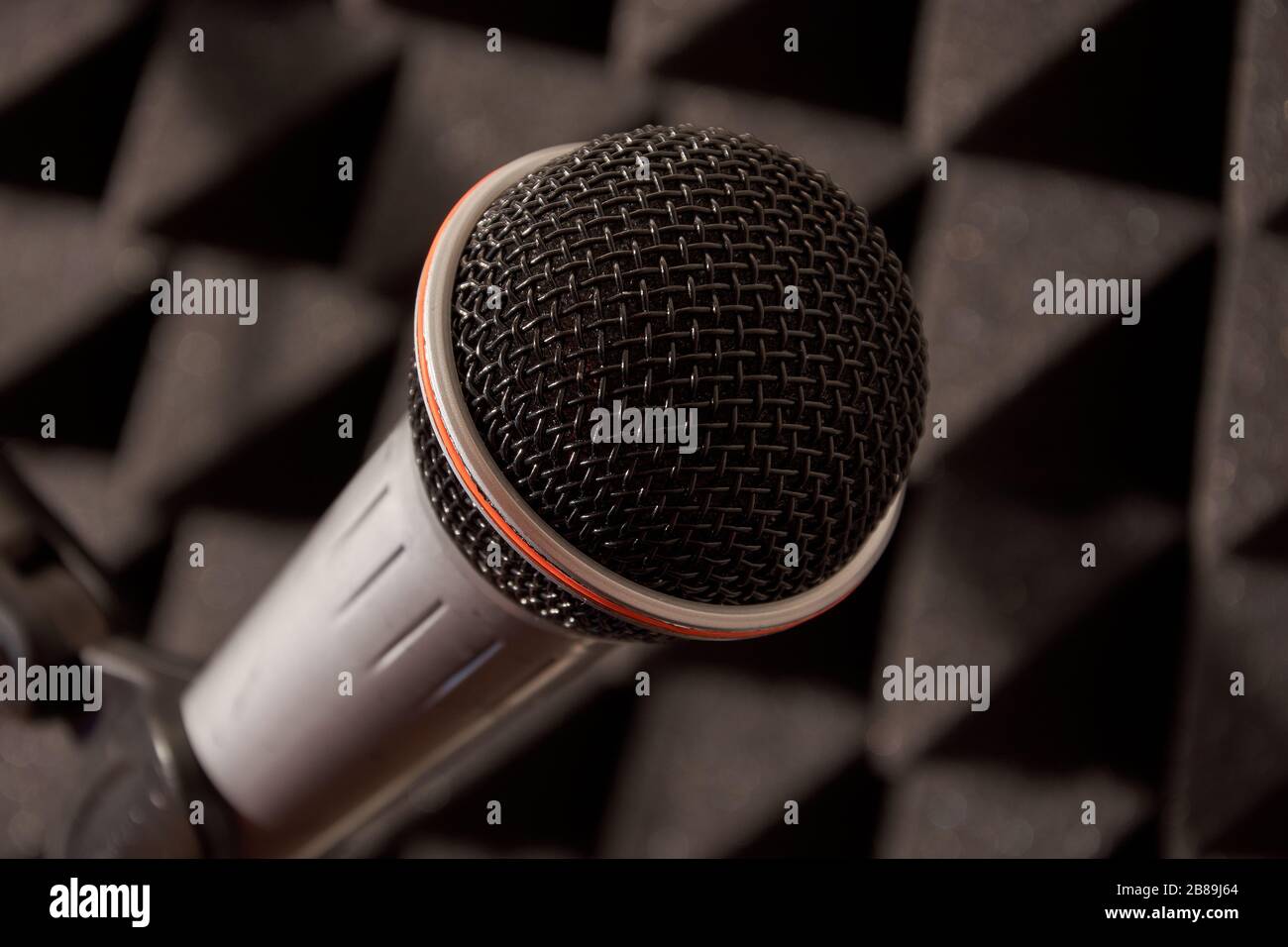 dynamic microphone in the studio against the background of sound ...