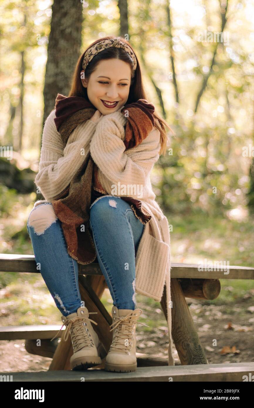 Young woman at picnic table hi-res stock photography and images - Alamy
