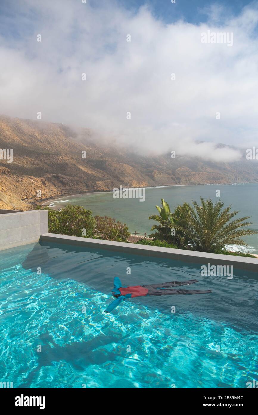 A wetsuit floats in a swimming pool Stock Photo - Alamy