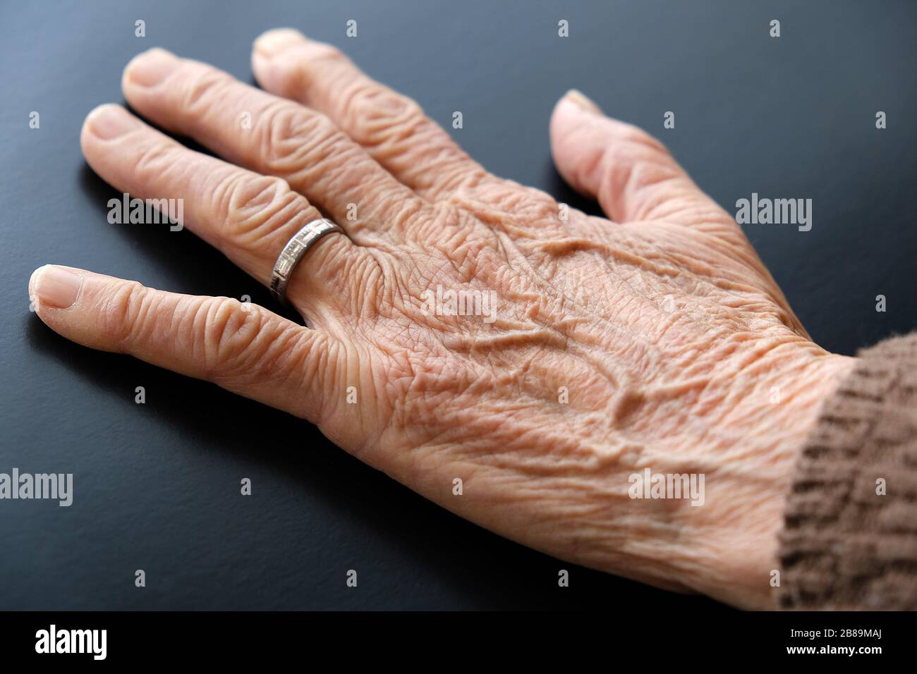 80 years old woman's hand, old human hand with veinsvery old human hand ...