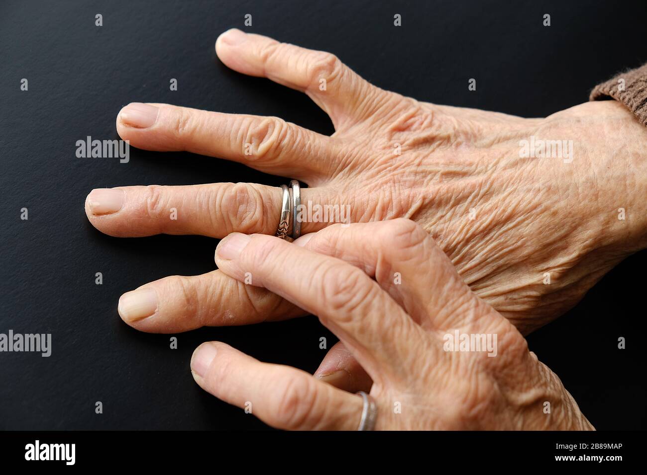 elderly woman's hand with a ring on her finger, old woman's hand and ...