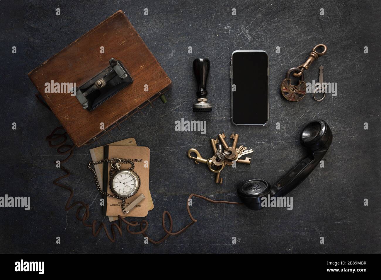 different means of vintage communication surrounding a cell phone Stock ...