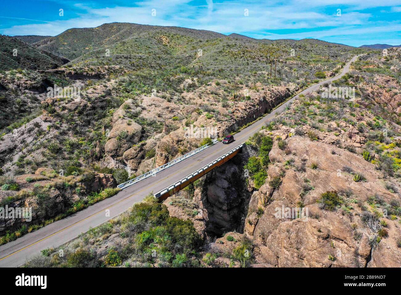 Aerial view of bridge, road and canyon landscape between the mountains ...