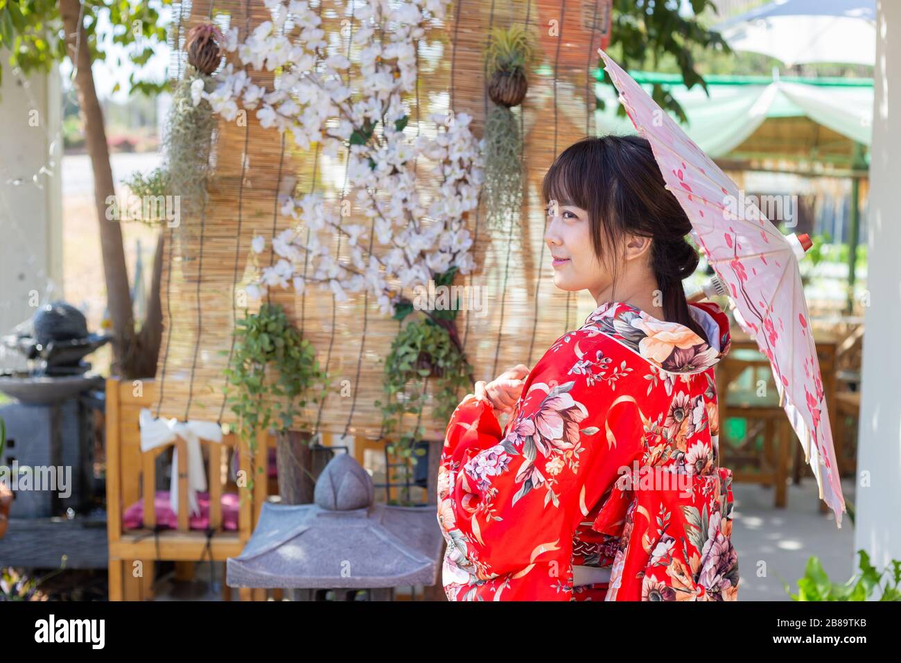 The Girl Is Wearing A Red Traditional Kimono Which Is The National
