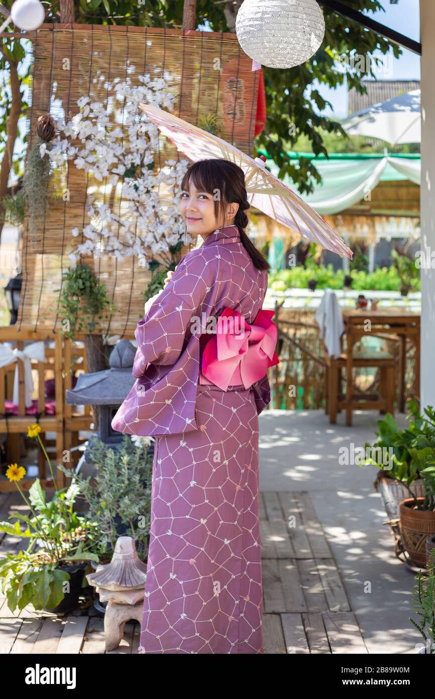 The girl is wearing a pink traditional yukata, which is the national ...