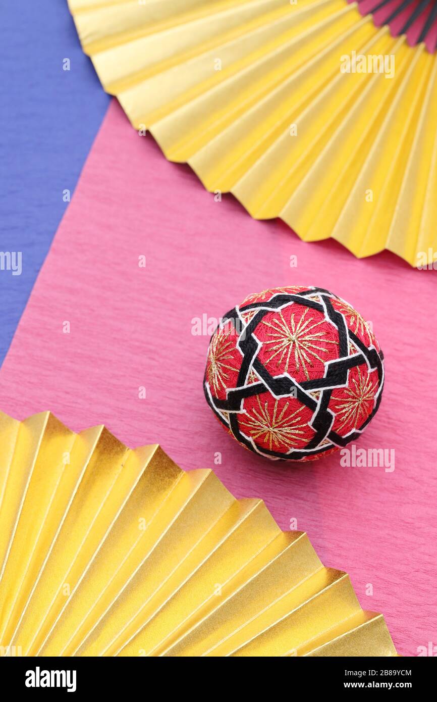 Japanese traditional colorful temari ball with golden folding fan Stock ...