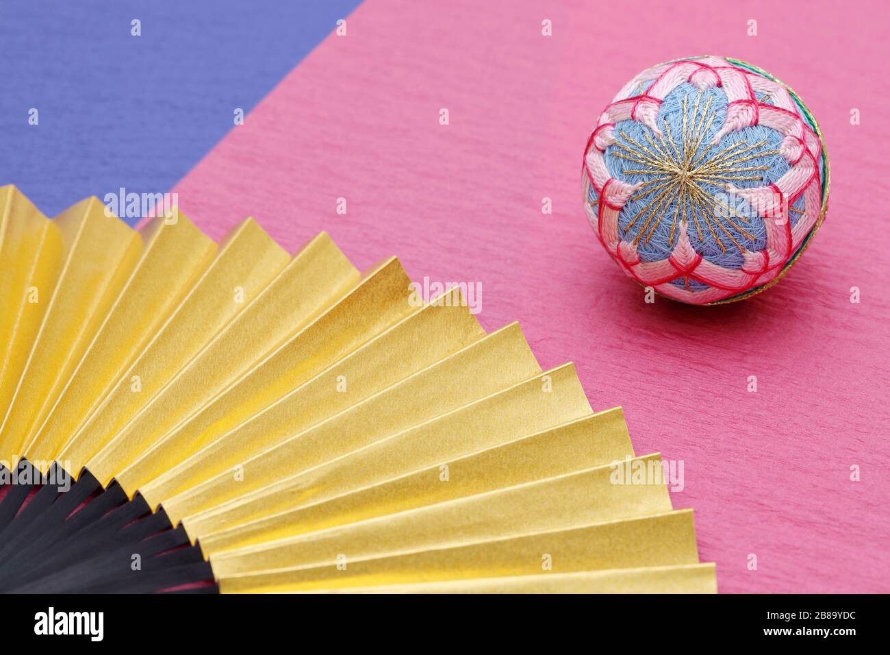 Japanese traditional colorful temari ball with golden folding fan Stock ...