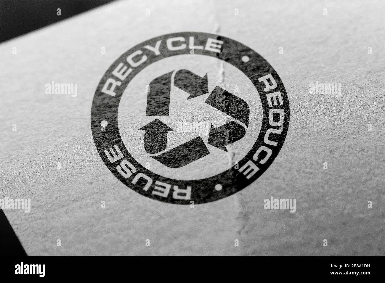 Recycle logo on recycled paper background Stock Photo - Alamy