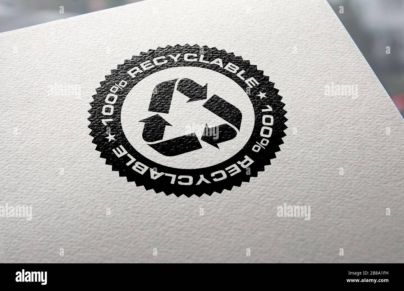 Recycle logo on recycled paper background Stock Photo - Alamy