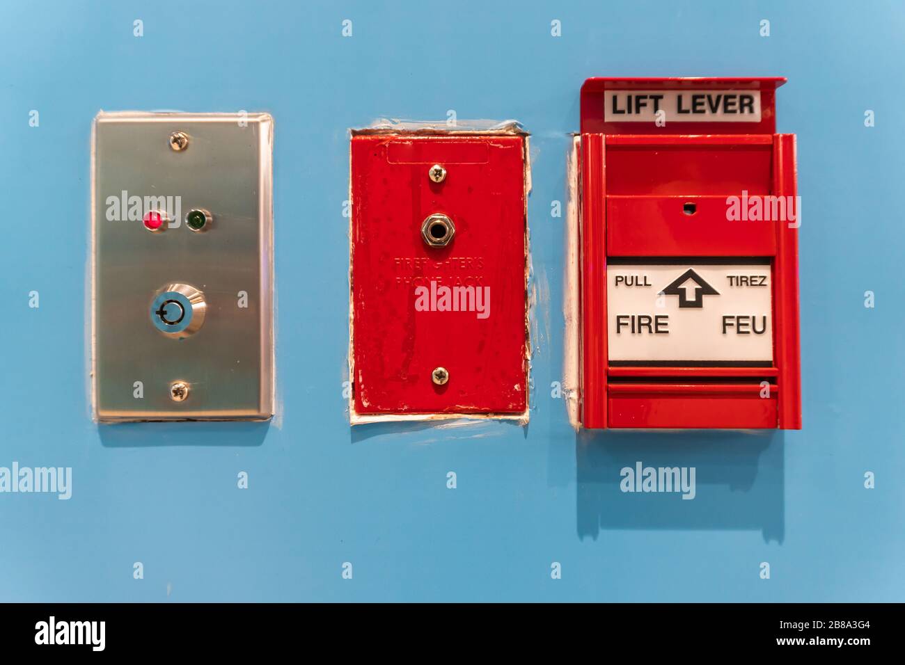 Fire alarm switch button emergency on blue wall texture background ...