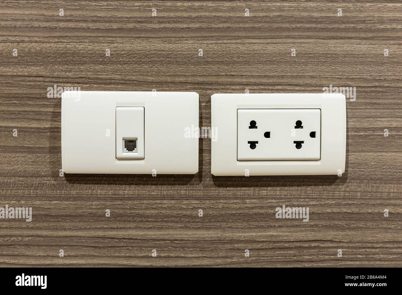 Wall socket and telephone wall socket in room for plug or phone jack ...