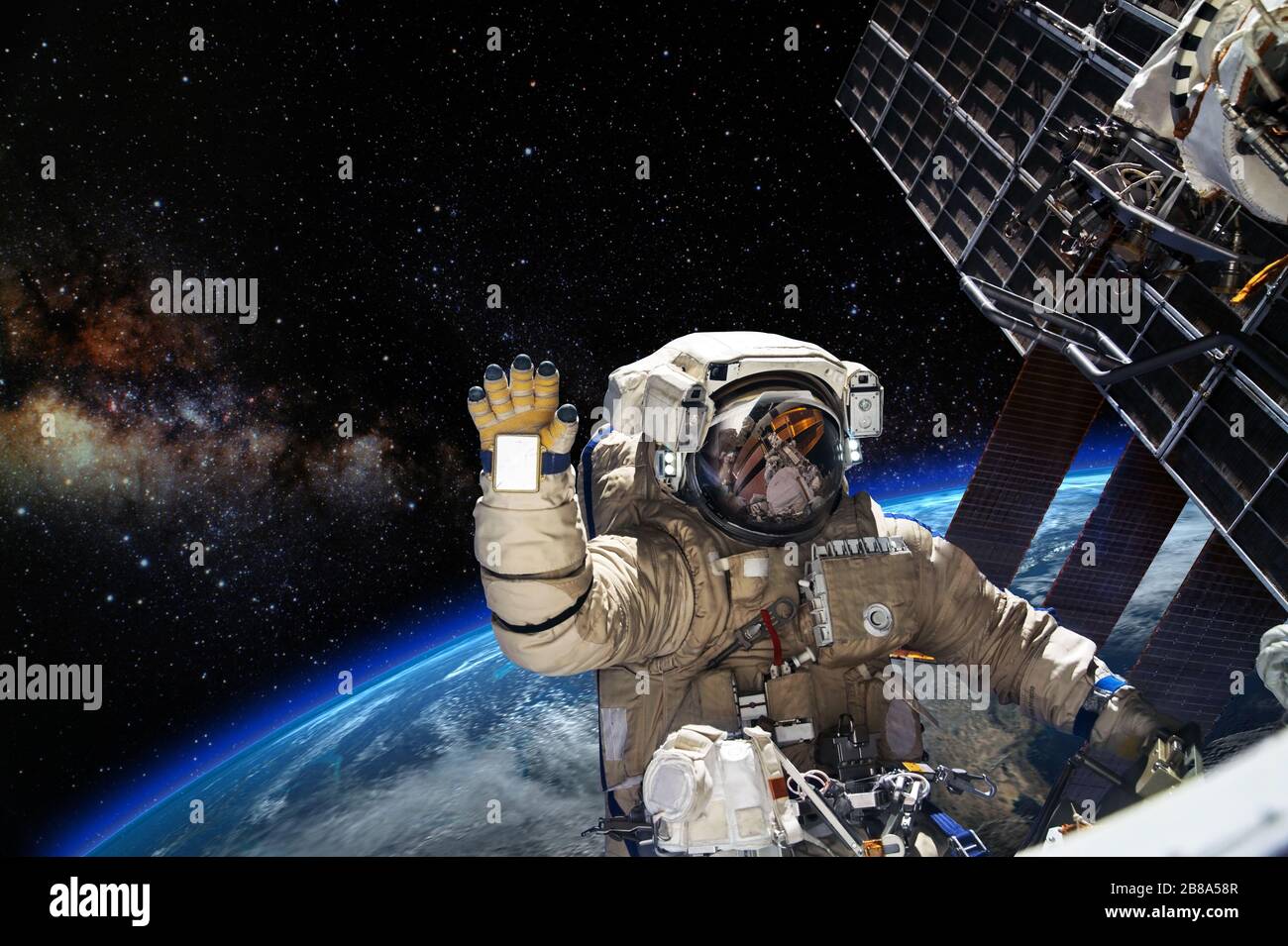 Astronaut on space mission with earth on the background. Elements of ...