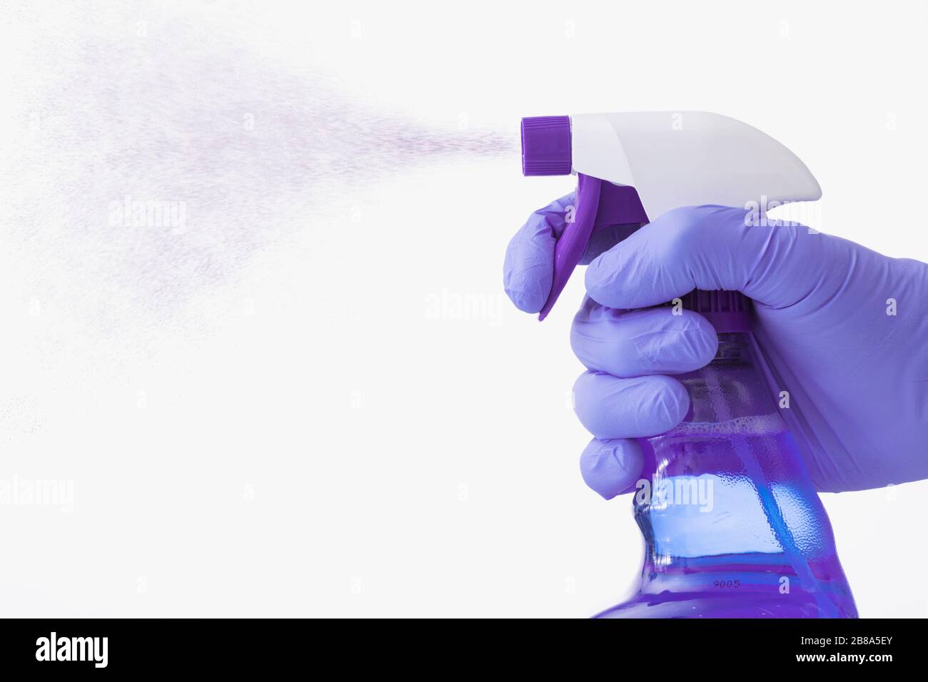 hand spraying cleaner from bottle Stock Photo - Alamy