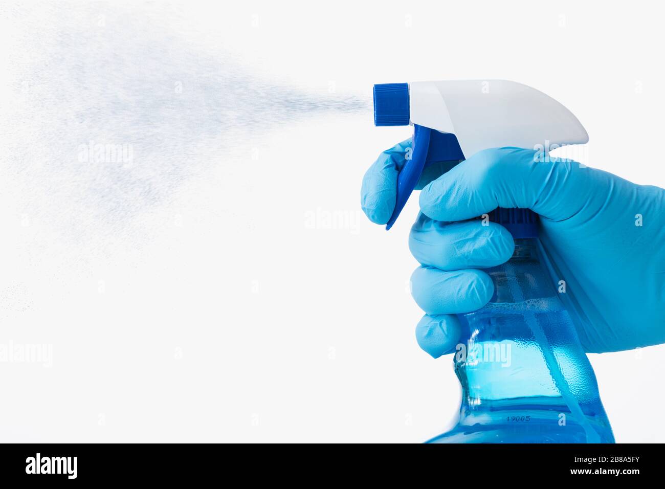 hand spraying cleaner from bottle Stock Photo - Alamy