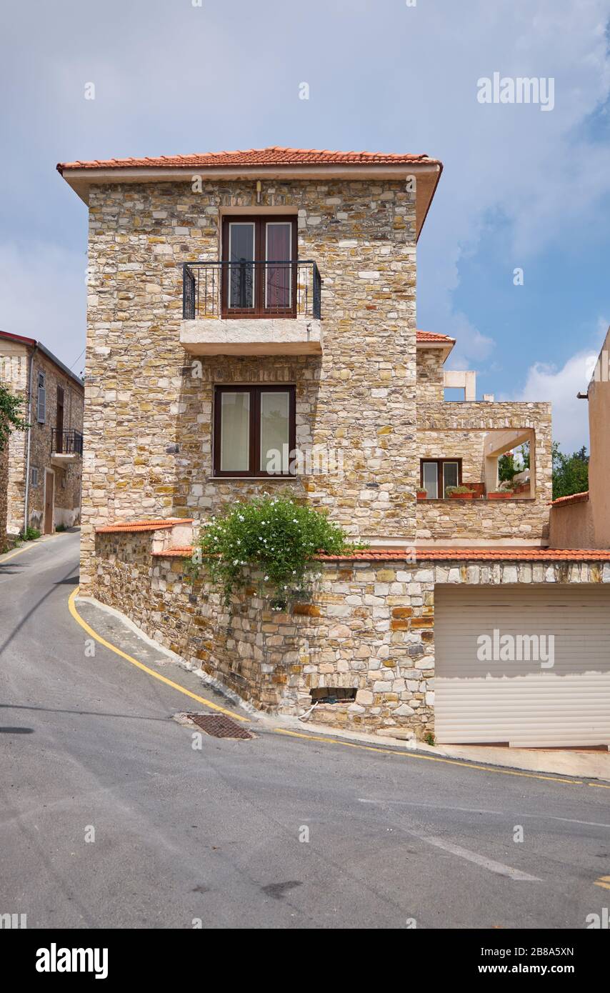 The traditional white stone house on the street of Lefkara village ...