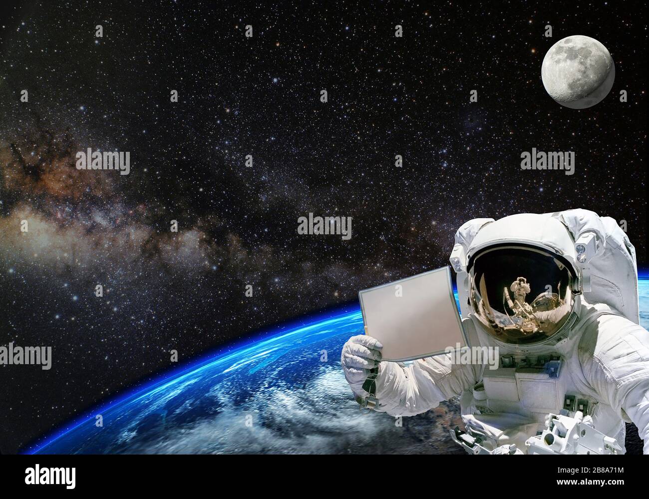 Astronaut holding blank template sign with earth on the background ...