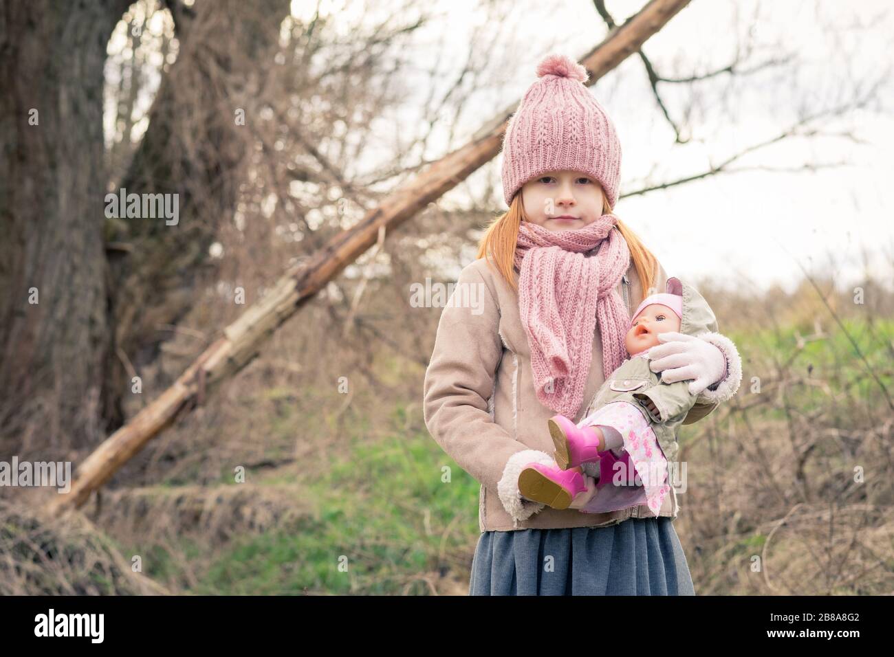 Hands holding toy doll hi-res stock photography and images - Alamy