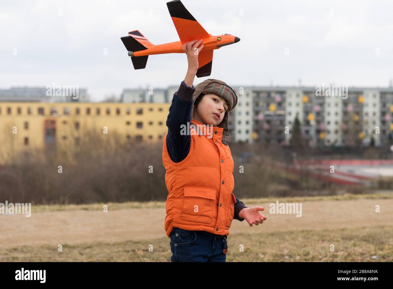 Boy playing in nature with a model of a glider (airplane Stock Photo ...