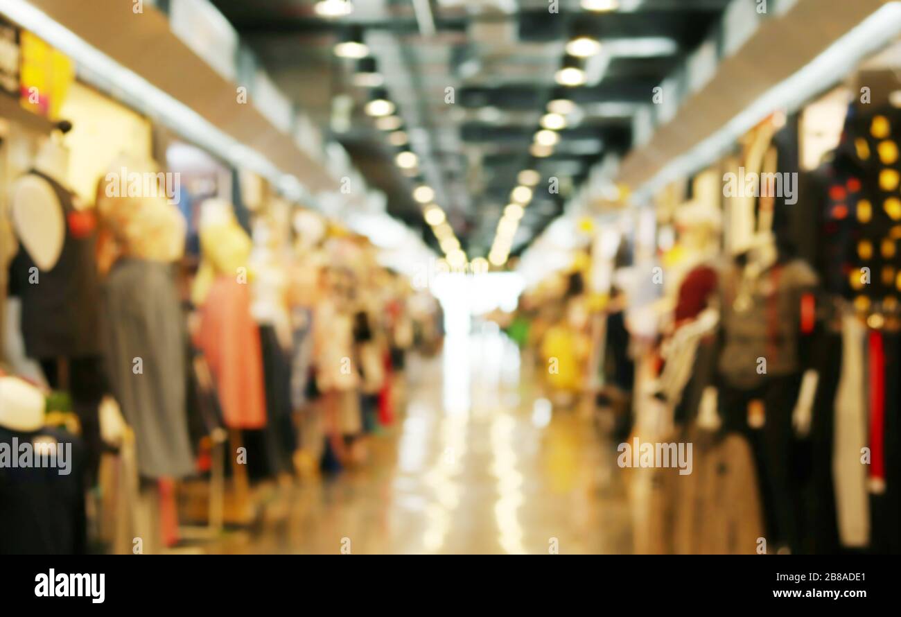 Blurred picture of Clothing store fashion shop inside shopping mall ...
