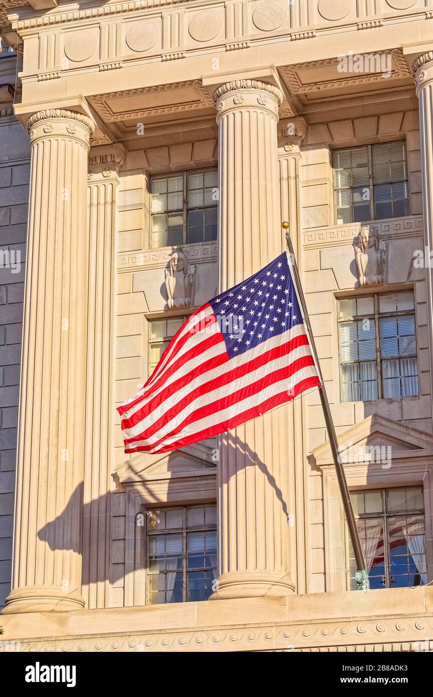 USA flag on facade of US Commerce building in Washington DC Stock Photo ...