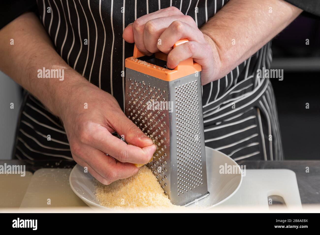 Cheddar cheese block metal cheese grater hi-res stock photography and ...