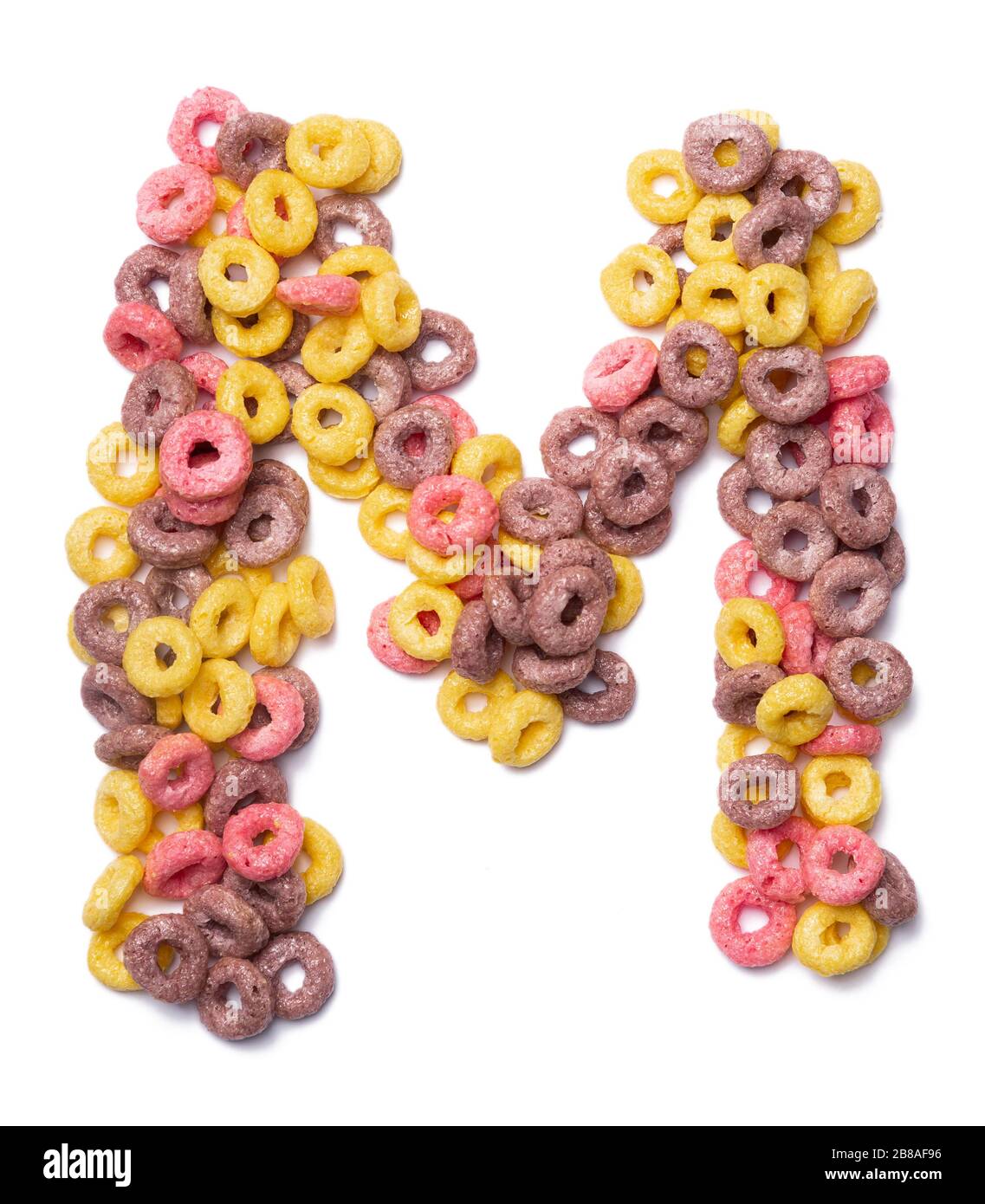 Letter M of the English alphabet from pink colored flakes on a white ...